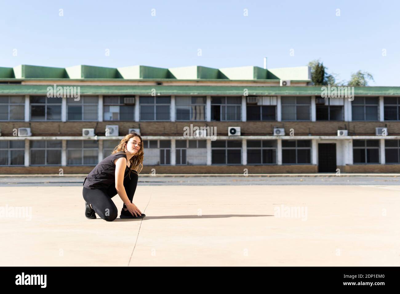 Crouching teen girl one hi-res stock photography and images - Alamy
