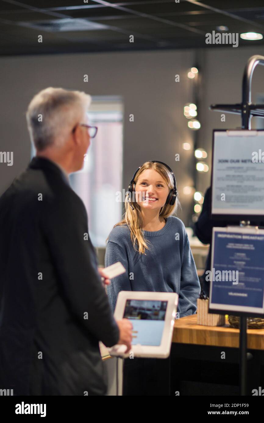 Smiling people in reception Stock Photo - Alamy