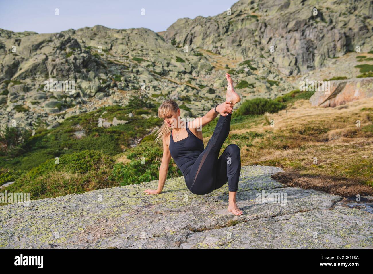 woman doing yoga poses in nature mountain peace Stock Photo - Alamy