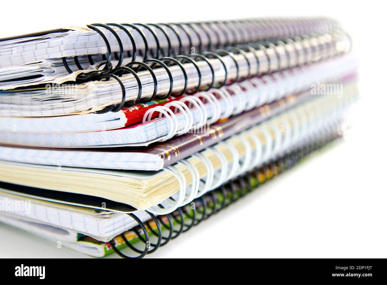 stack of notebooks isolated on a white background Stock Photo - Alamy