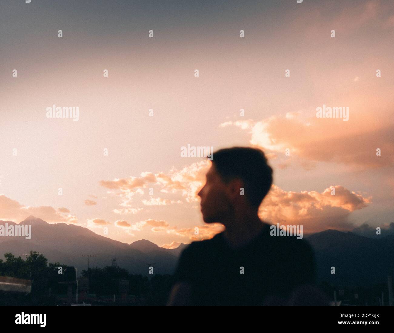 man admiring the sunset with his face blurred Stock Photo - Alamy