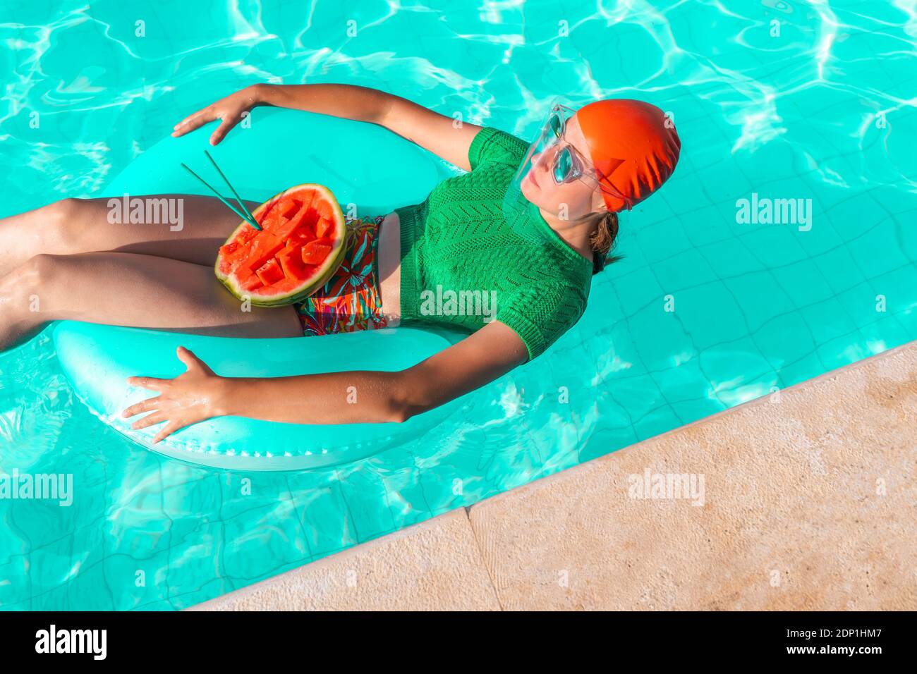 Woman with floating tire and watermelon in swimming pool Stock Photo ...