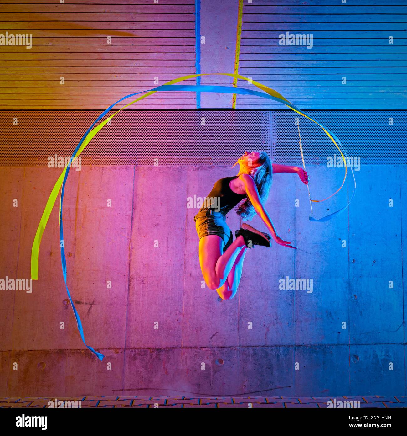 Woman jumping spinning ribbon hi-res stock photography and images - Alamy