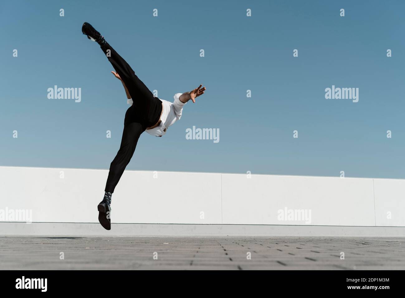 Artist practising on roof terrace Stock Photo - Alamy