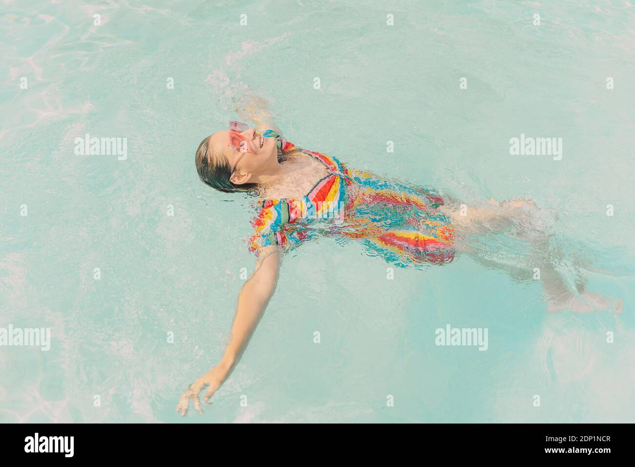 Woman floating pool hi-res stock photography and images - Alamy