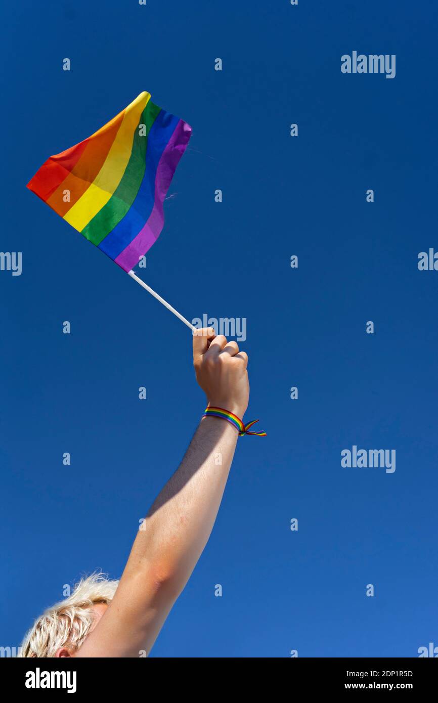 Arm waving LGBTQ pride flag Stock Photo - Alamy