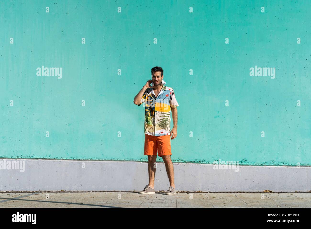 Cool man standing front green wall hi-res stock photography and images ...
