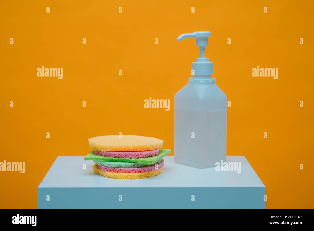 Cleaning sponges and sponge cloth in shape of a burger by spray bottle ...