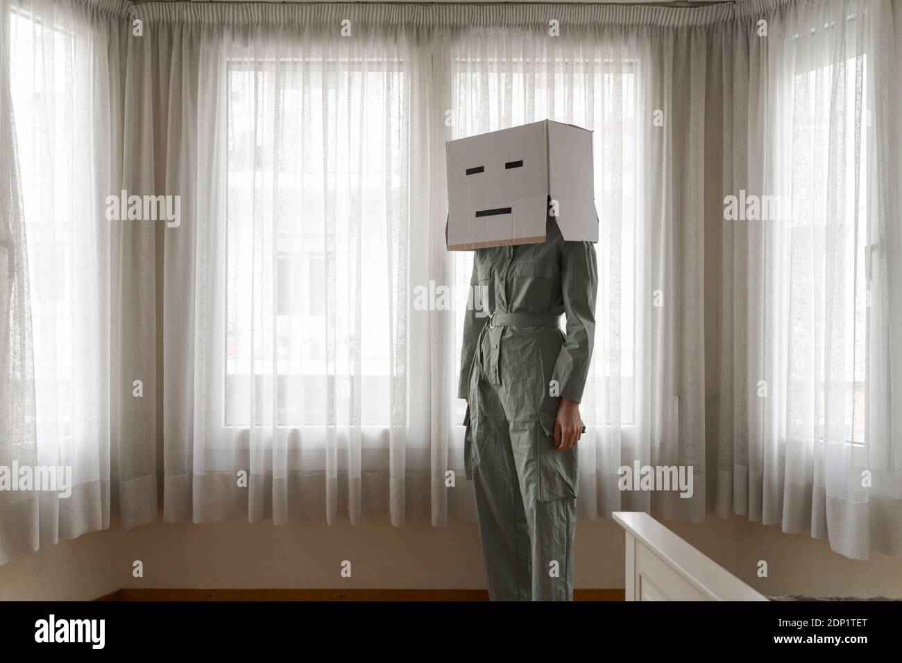 Woman wearing a cardbox on head with face Stock Photo - Alamy