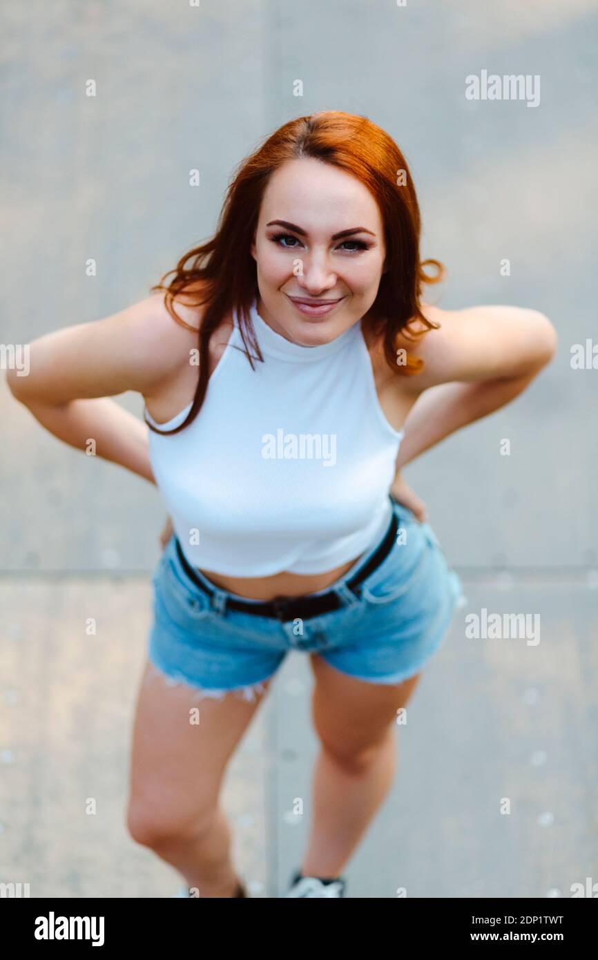 Portrait of smiling redheaded woman Stock Photo - Alamy