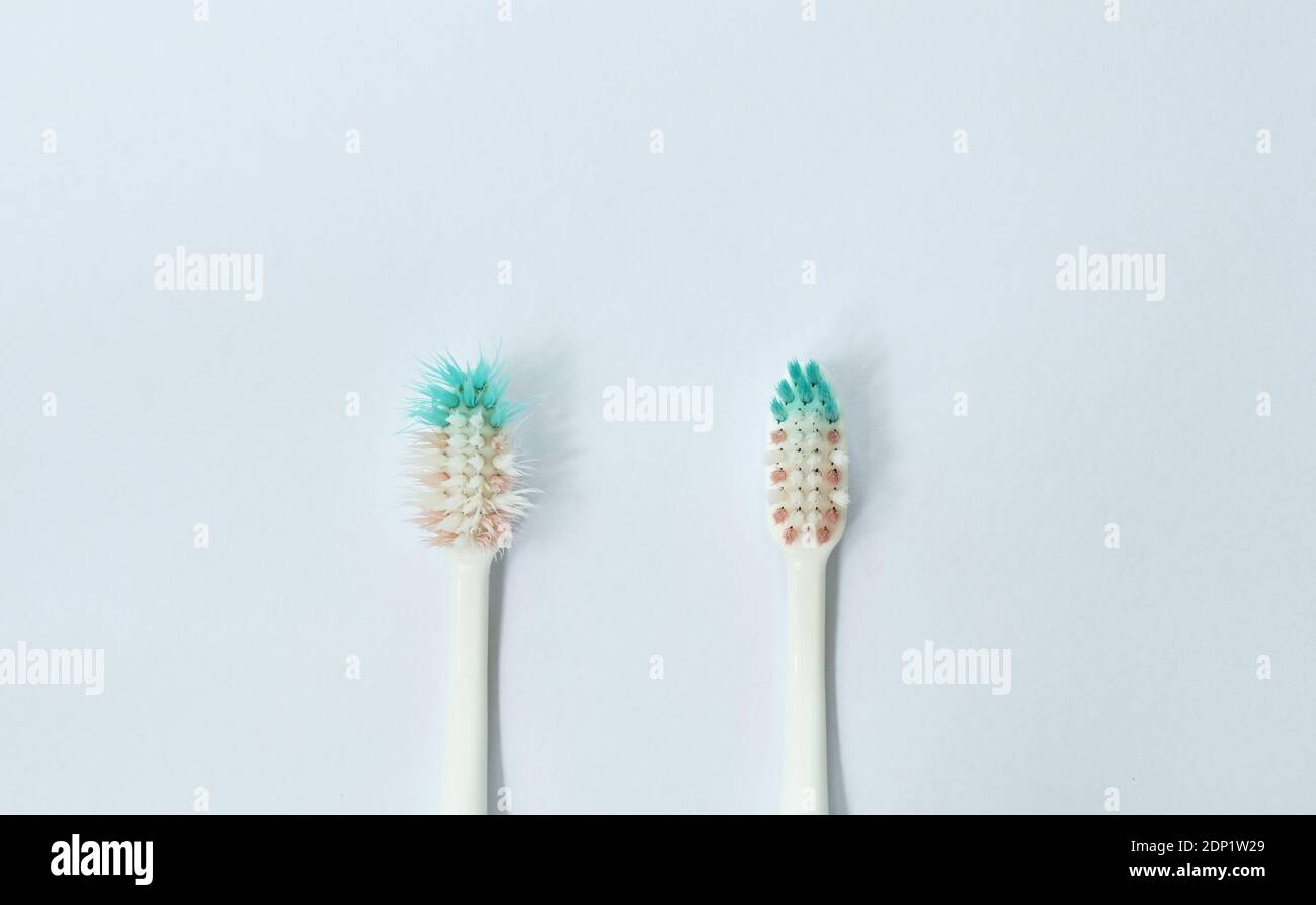 old and new toothbrush arranging on white background Stock Photo - Alamy