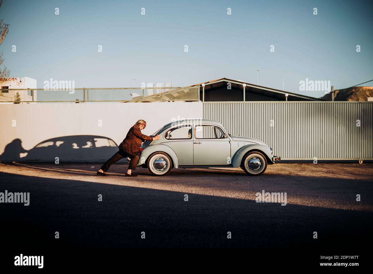 Man pushing car wheel hi-res stock photography and images - Alamy