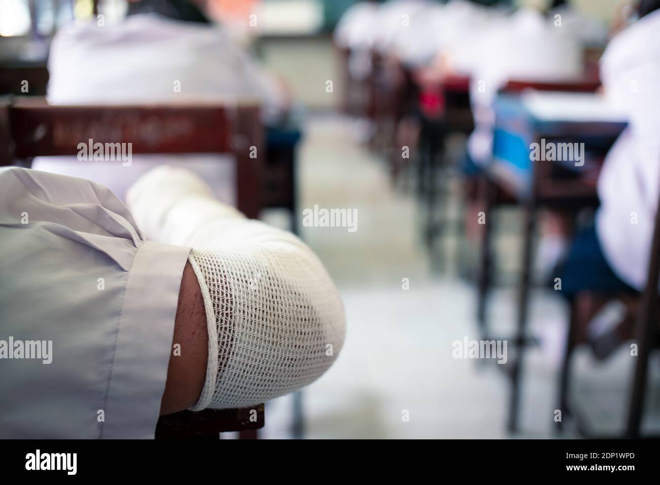 injured Students taking exam with stress in school classroom Stock ...