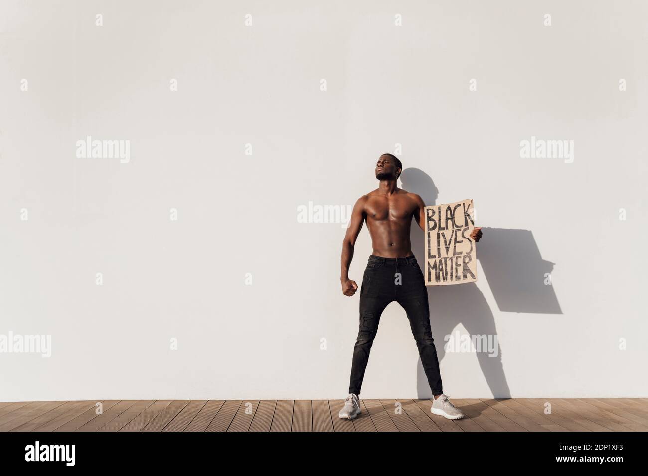 Black man holding Black Lives Matter sign Stock Photo - Alamy