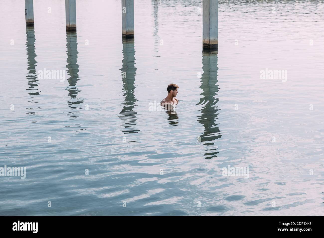 Young man bathing in the sea Stock Photo - Alamy