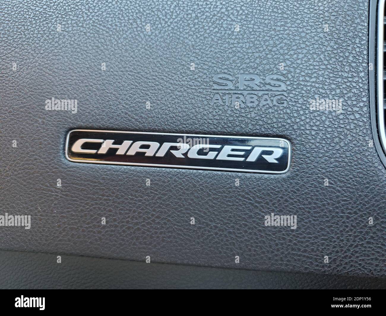 Close-up of the Dodge Charger logo on a car dashboard in Lafayette ...
