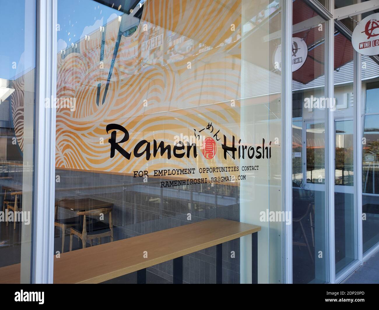 Side view of the signage on the glass storefront of the Ramen Hiroshi ...