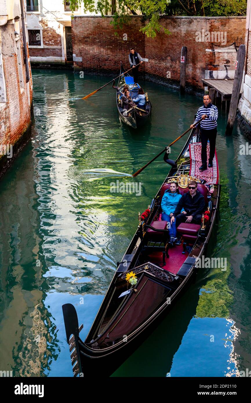 Visitors Taking A Gondola Ride, Venice, Italy Stock Photo - Alamy