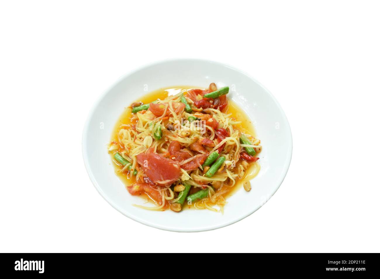Som tum Thai spicy green papaya salad on dish Stock Photo - Alamy