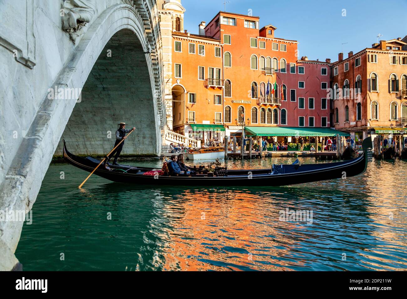 A Couple Take A Romantic Gondola Ride On The Grand Canal, Venice, Italy ...