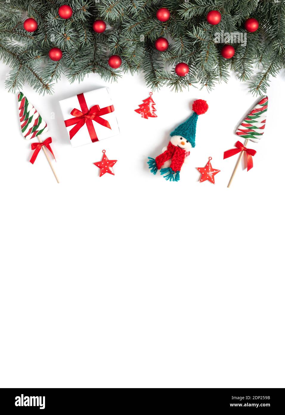 Christmas border with fir branches, snowman, lollipops and Christmas ...
