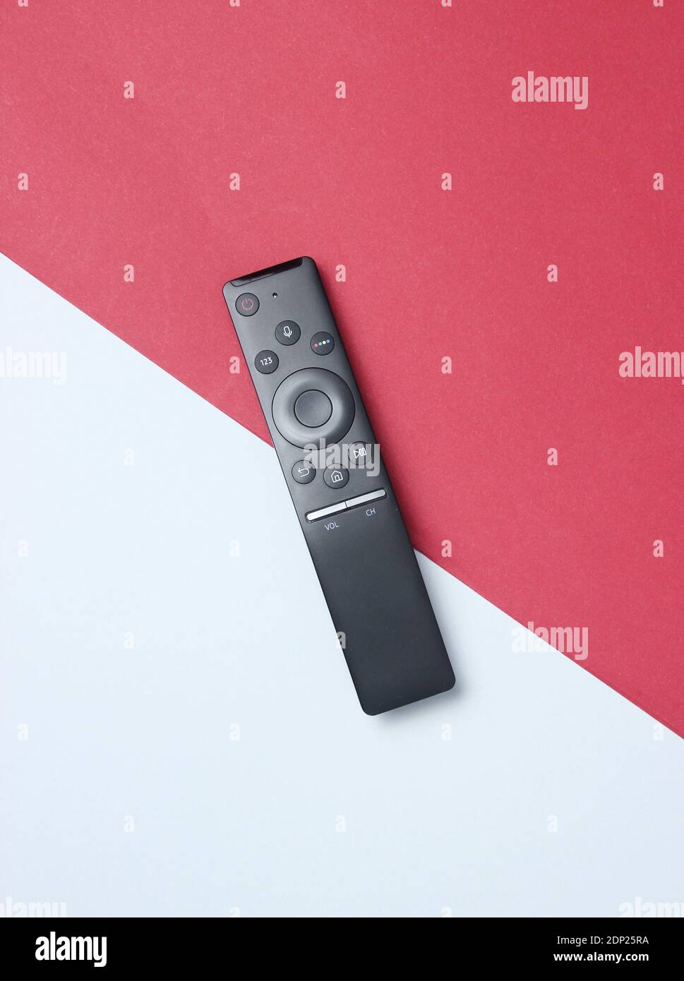 Modern smart tv remote on gray-red paper background. Top view ...