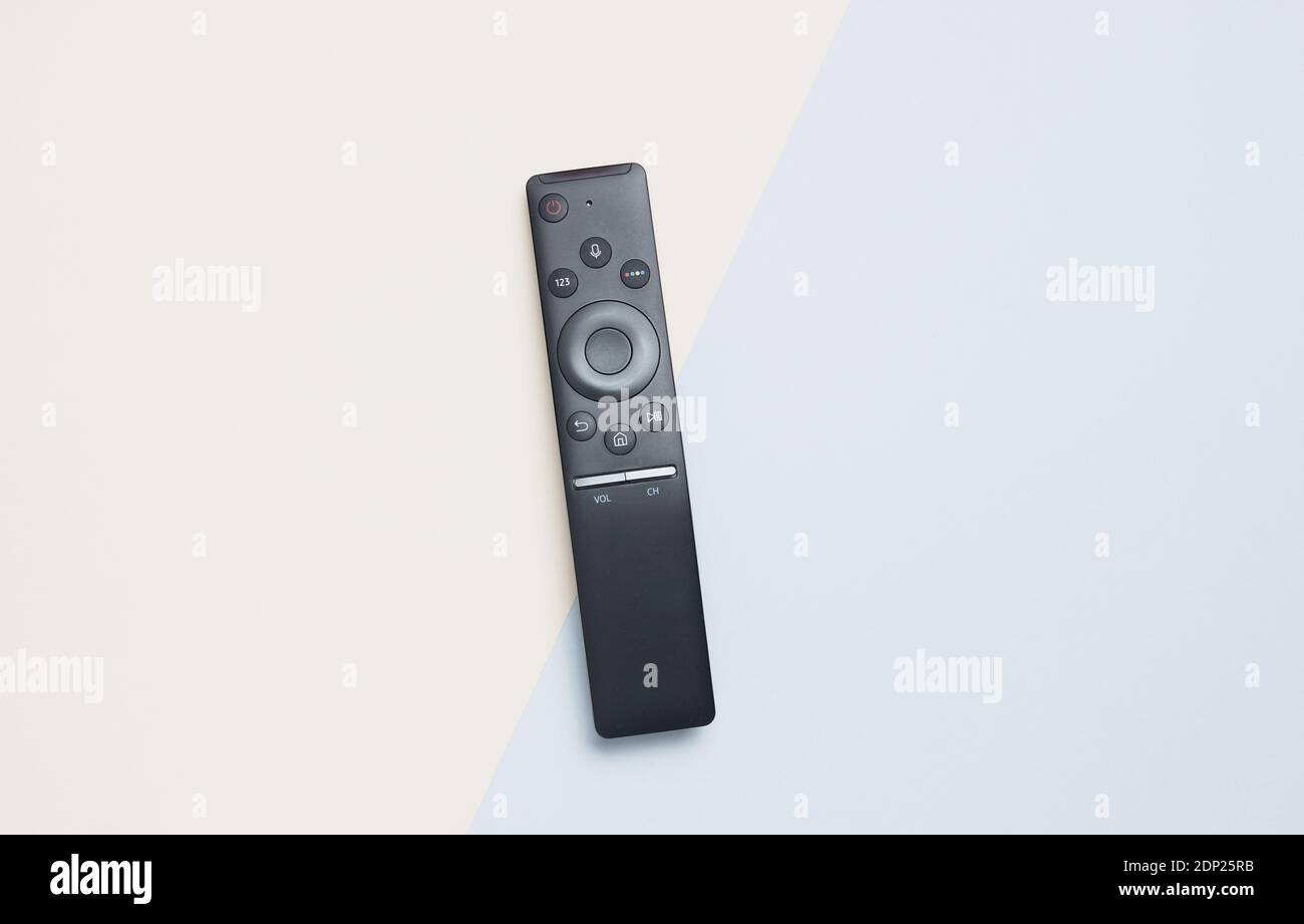 Modern smart tv remote on pastel paper background. Top view. Minimalism ...