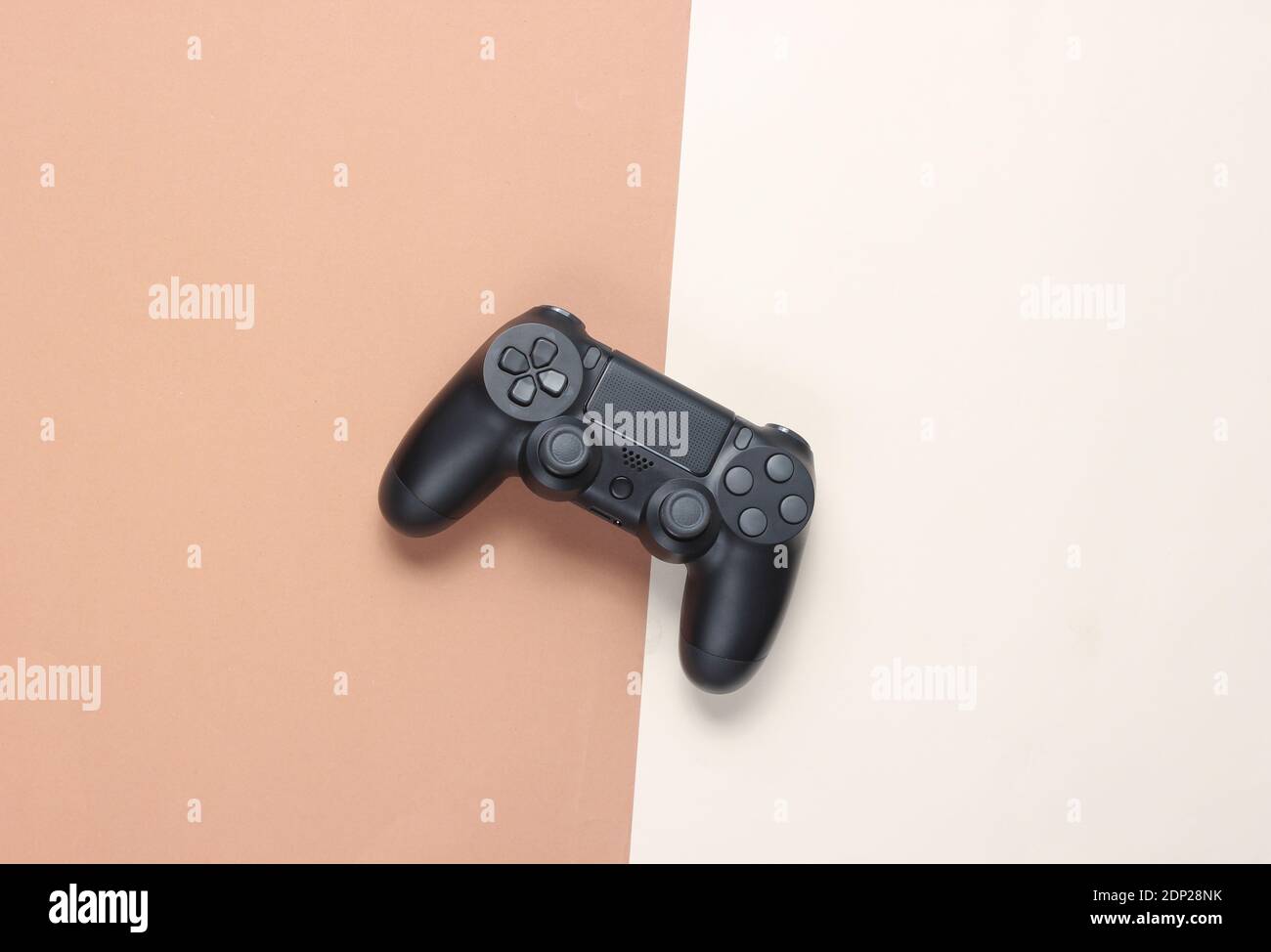 Gamepads on a colored paper background. Top view. Minimalism Stock ...