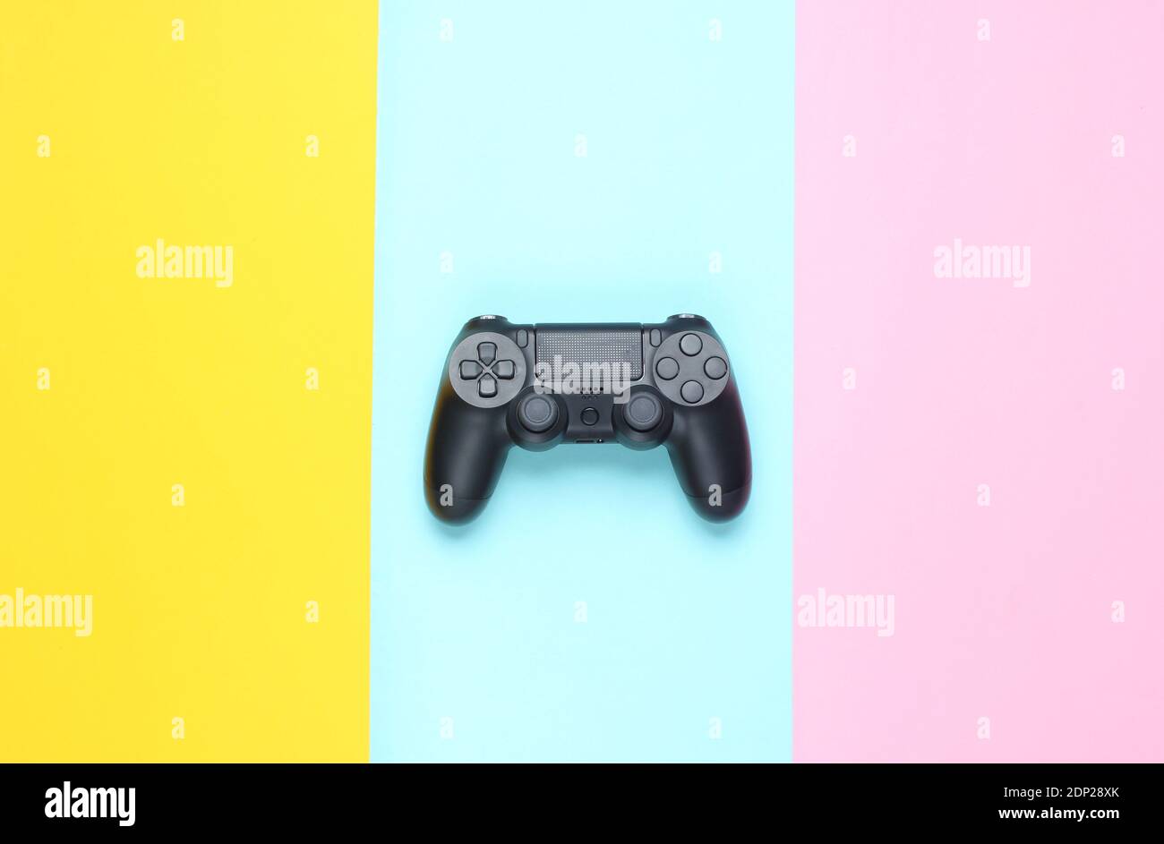 Gamepads on a colored paper background. Top view. Minimalism Stock ...