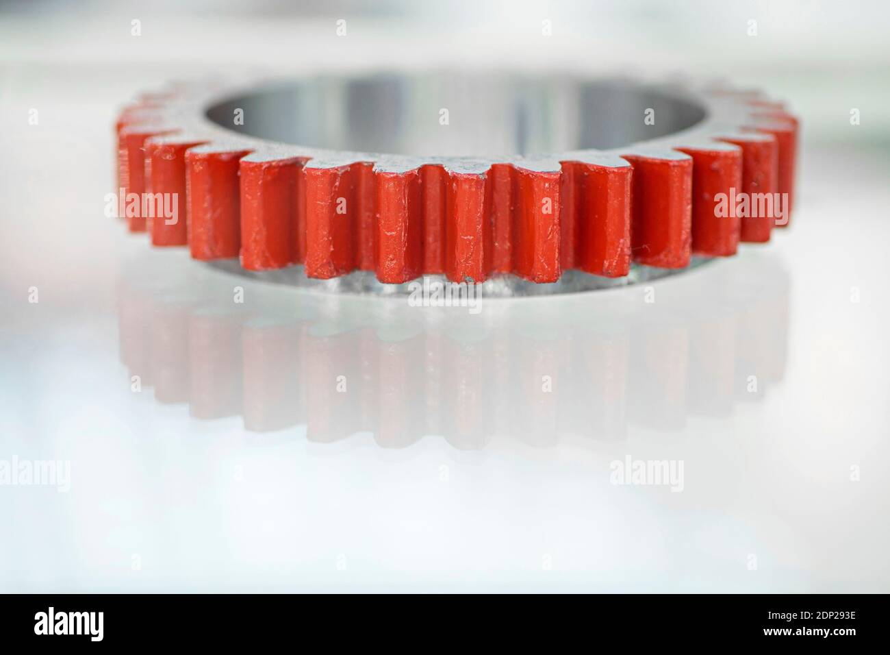 Orange cogwheel on white background Stock Photo - Alamy