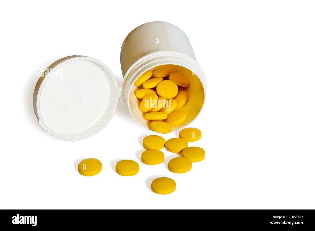 yellow pills with container isolated on white Stock Photo - Alamy