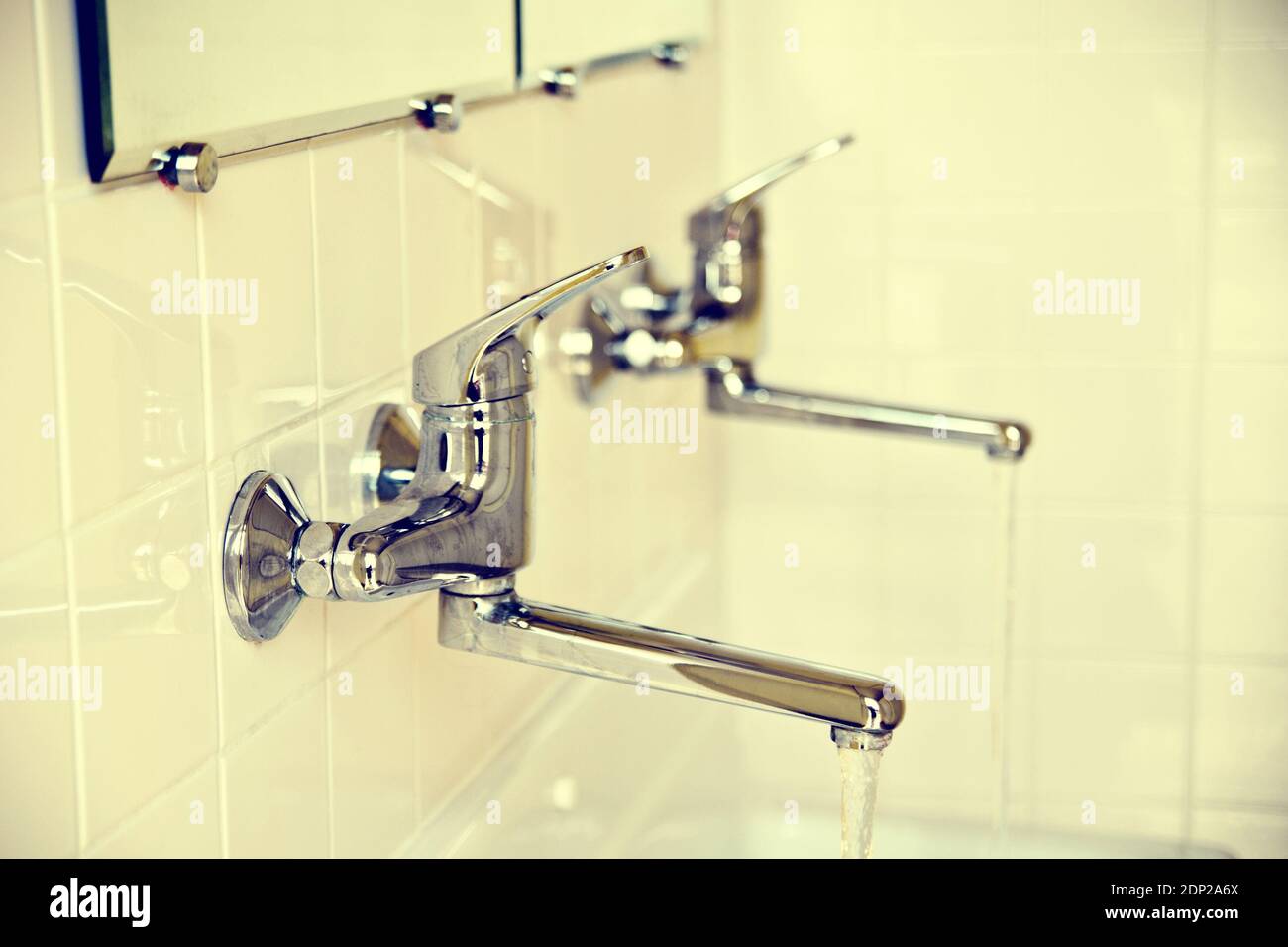 two water taps in the bathroom Stock Photo - Alamy