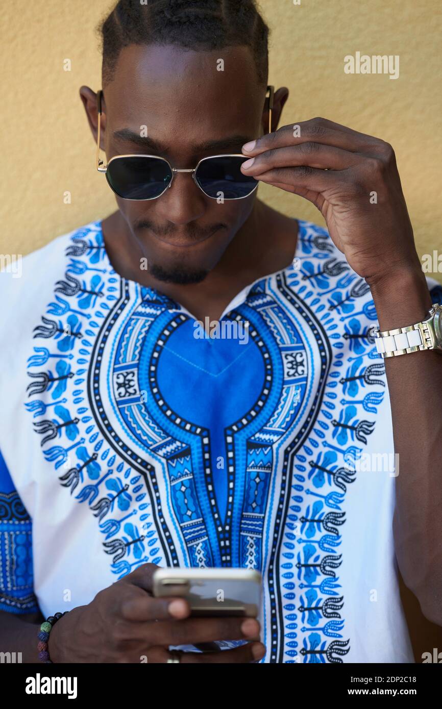 native african black man using smart phone Stock Photo - Alamy