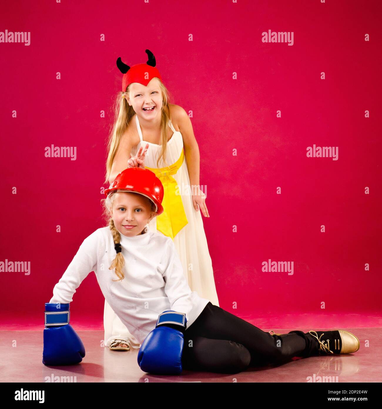 two little girls playing in studio Stock Photo - Alamy