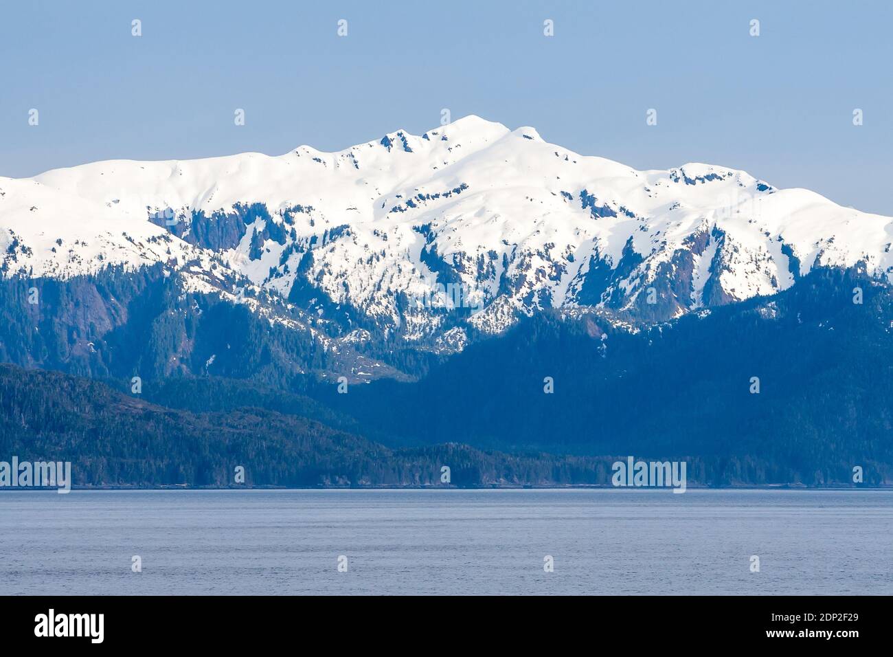 Snow-capped mountains along the coast of southern Alaska Stock Photo ...