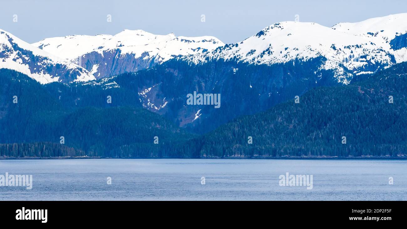 Snow-capped mountains along the coast of southern Alaska Stock Photo ...