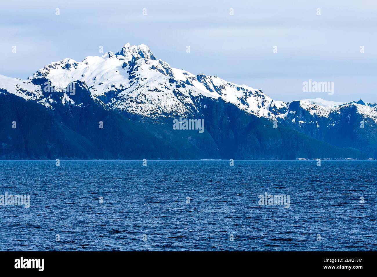 Snow-capped mountains along the coast of southern Alaska Stock Photo ...