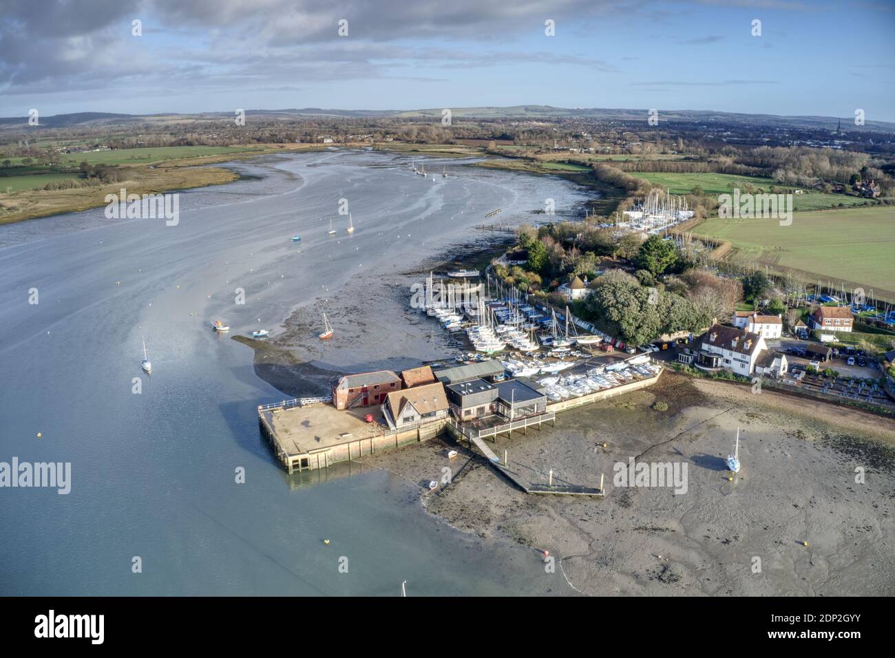 Aerial view of Dell Quay with yachts in the estuary and moored a ...