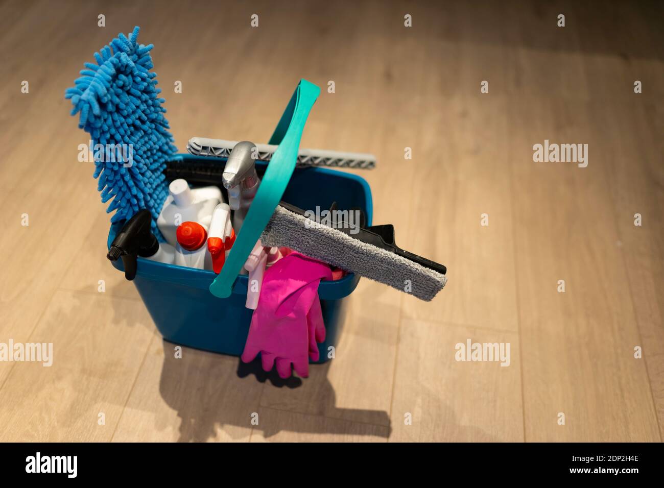Bucket of cleaning products on the floor Stock Photo - Alamy