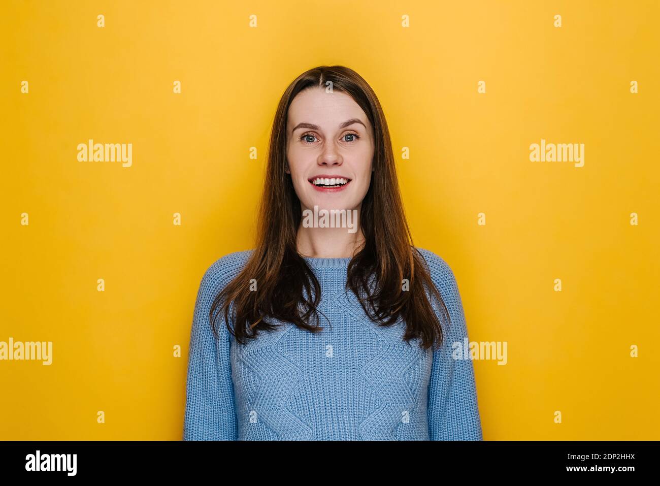 Overjoyed glad young woman with happy face keeps mouth wide opened ...