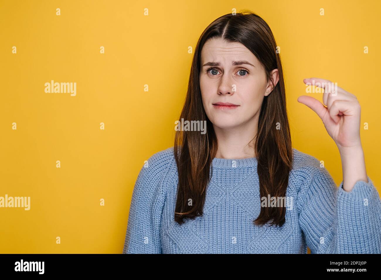 Caucasian hand showing small size hi-res stock photography and images ...