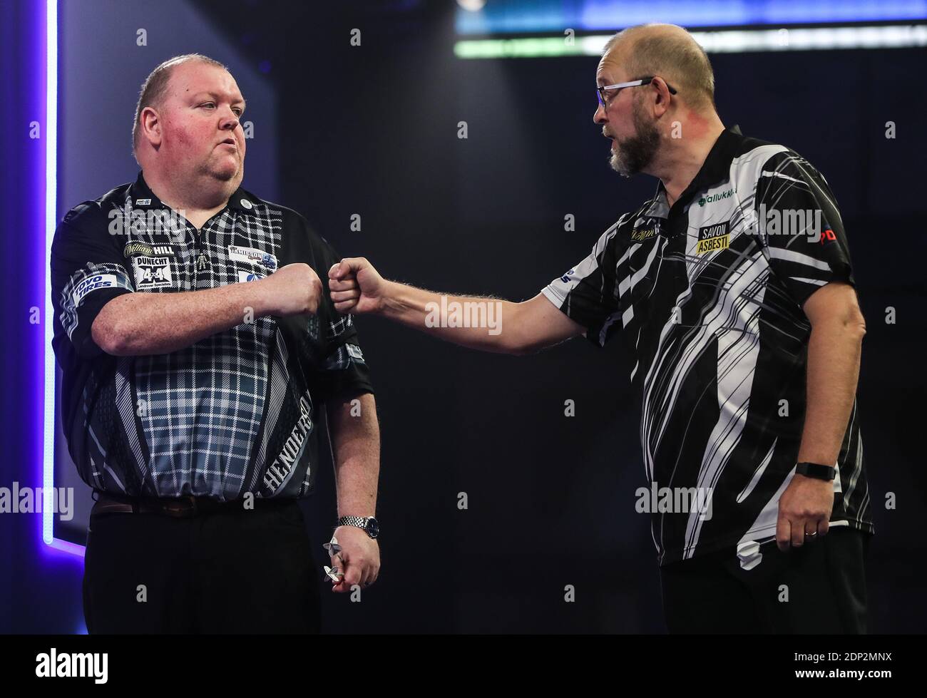 John Henderson (left) bumps fists with Marko Kantele after winning his ...