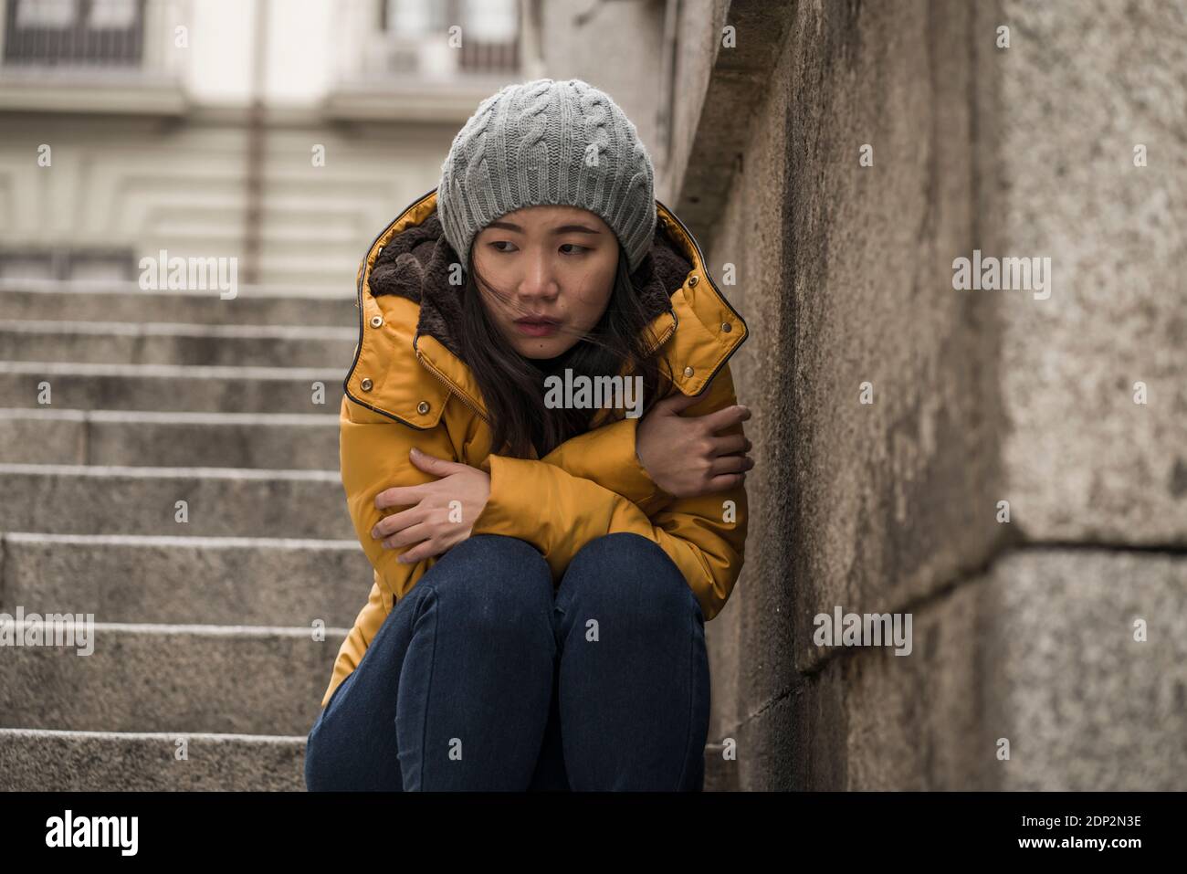 dramatic lifestyle portrait of young attractive sad and depressed ...