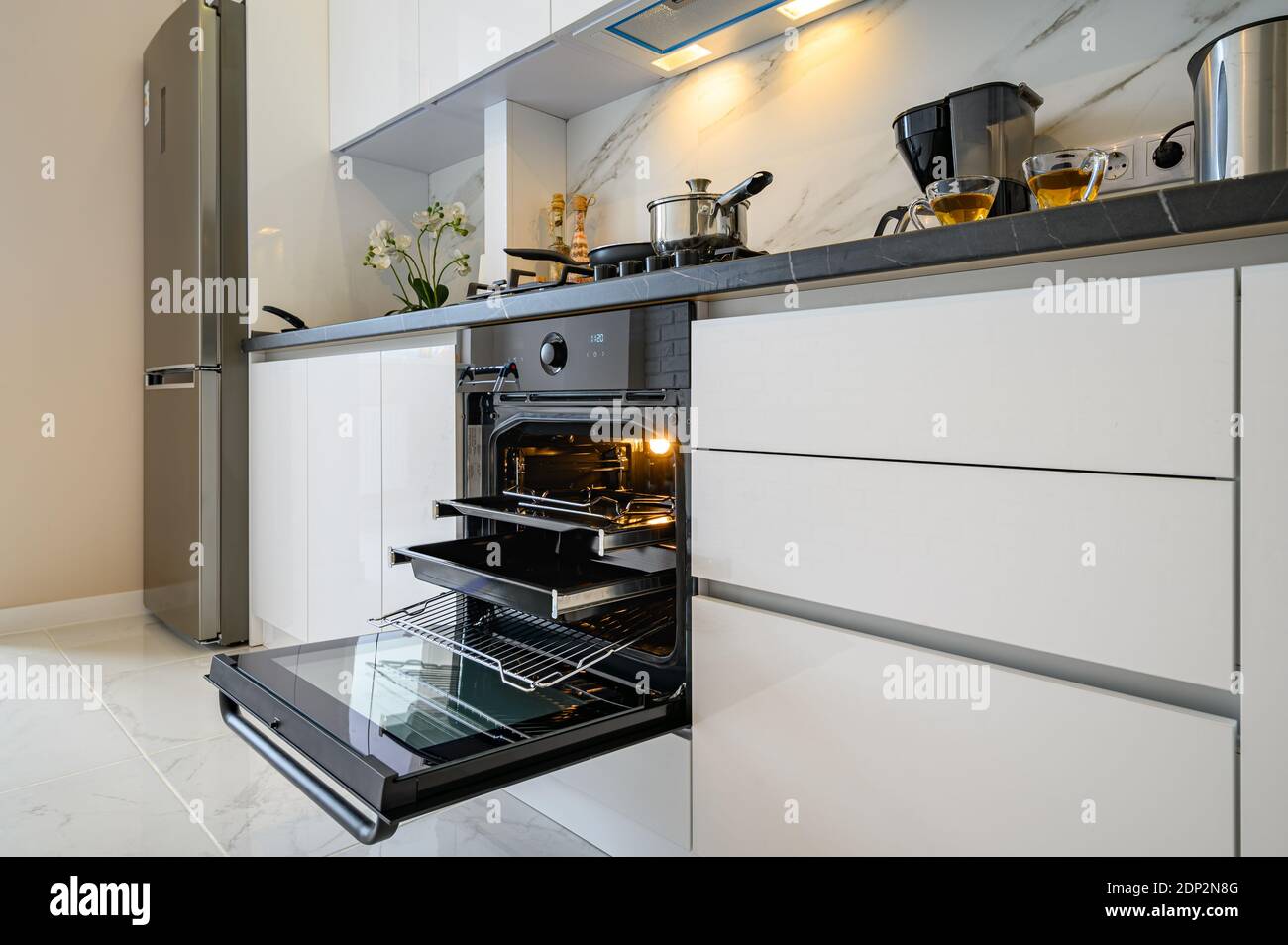 Open electric oven at white kitchen Stock Photo - Alamy