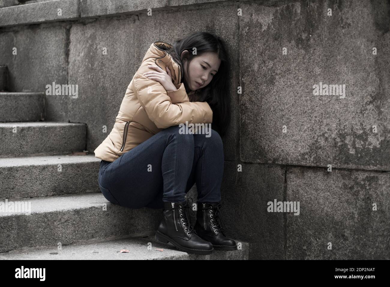 dramatic lifestyle portrait of young attractive sad and depressed ...