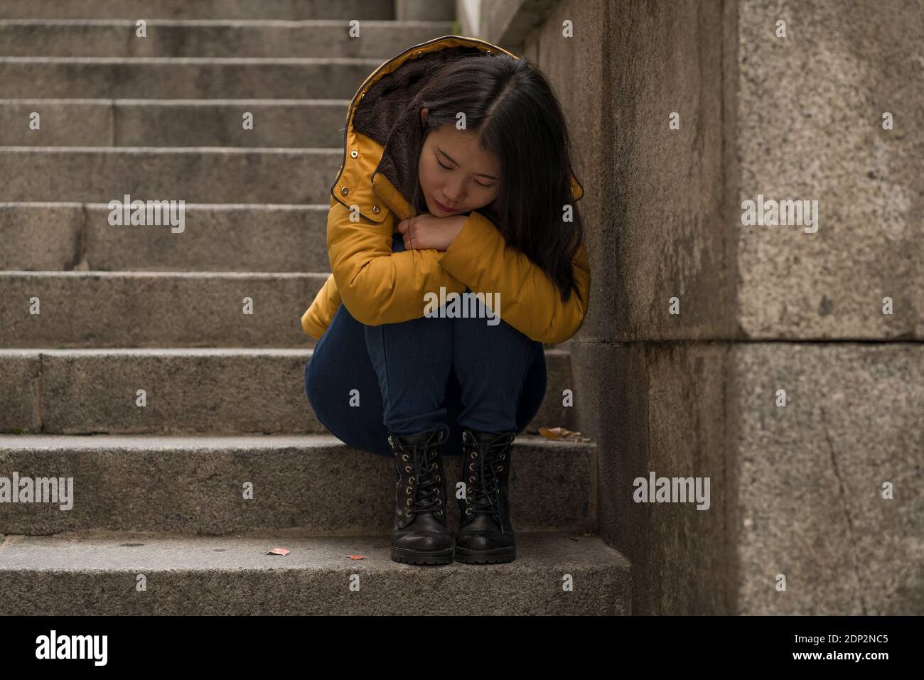 dramatic lifestyle portrait of young attractive sad and depressed ...