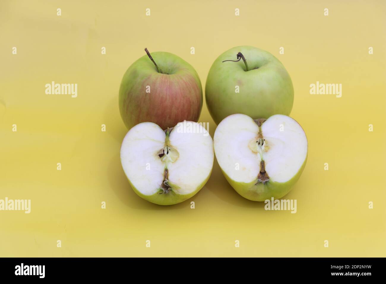 A few apples on yellow background, benefits of apples concept Stock ...
