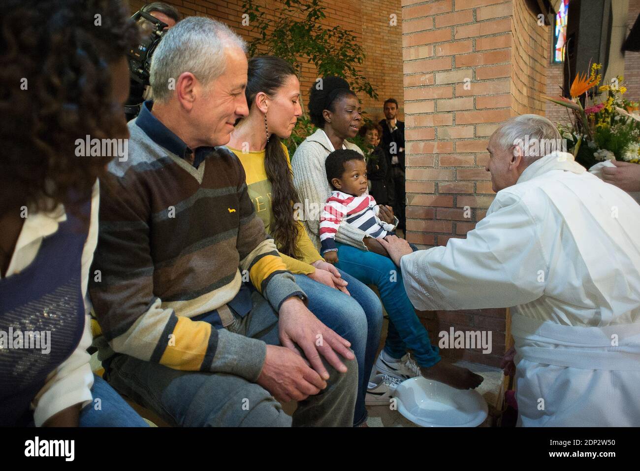 Washing feet with her tears hi-res stock photography and images - Alamy