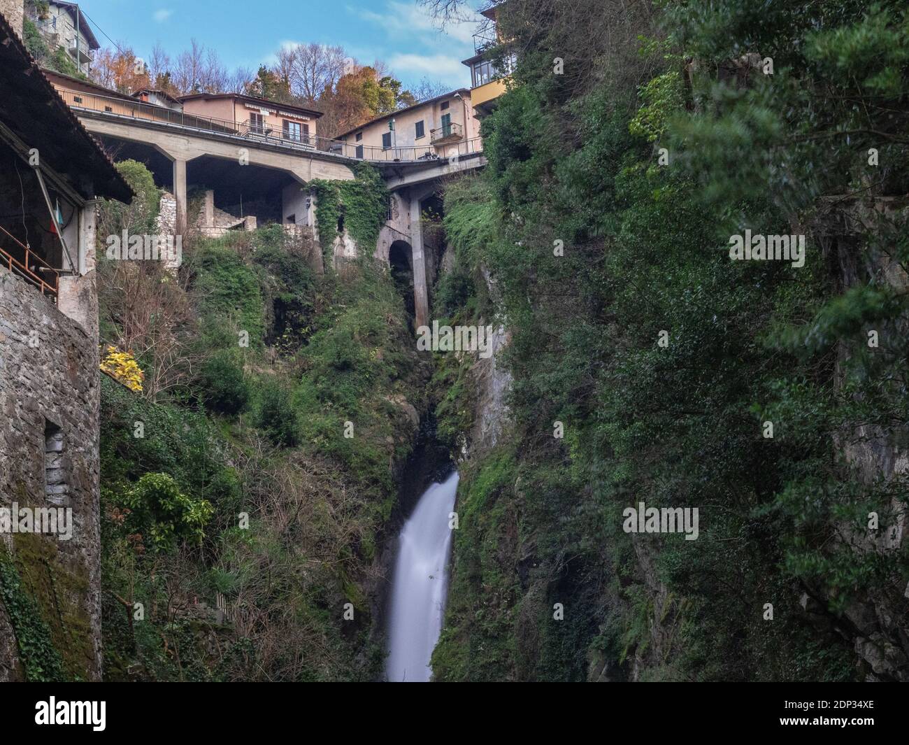 Canyon of Nesso with the waterfall seen from the Romanesque bridge of ...