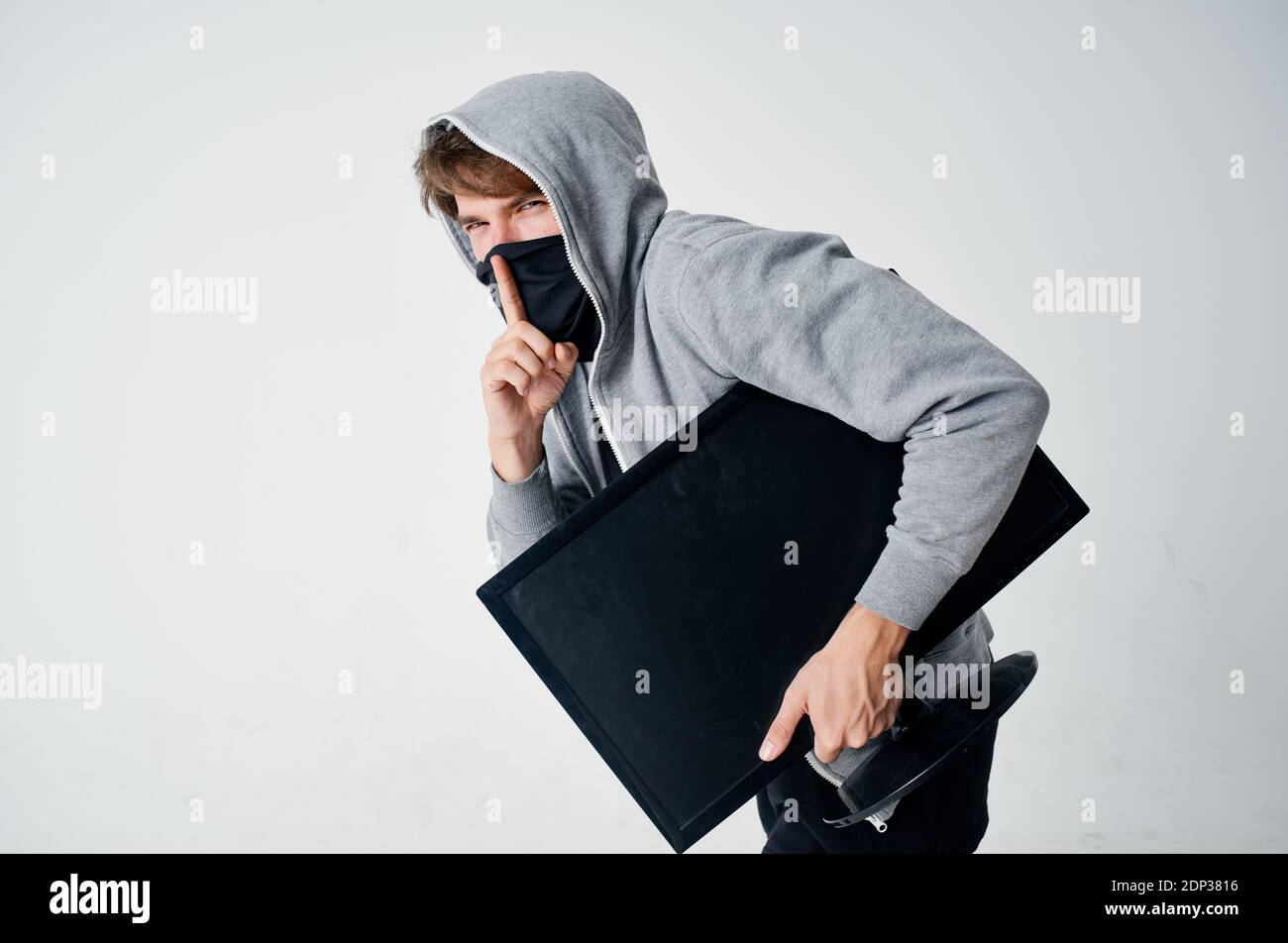 Masked man on computer hi-res stock photography and images - Alamy
